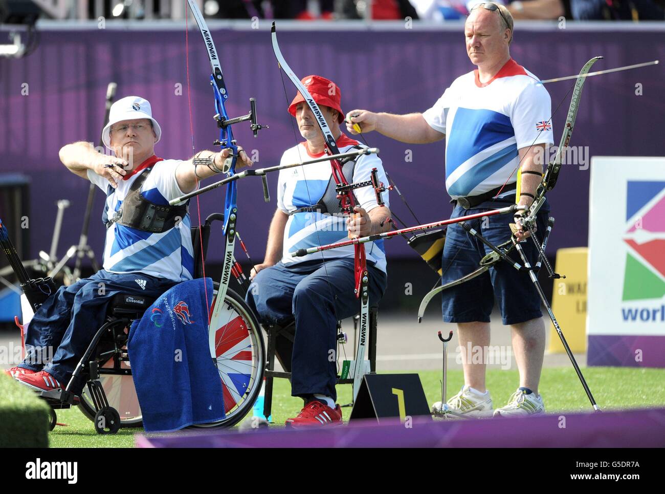 Great Britain's Paul Browne (left) competes with Phil Bottomley (centre ...