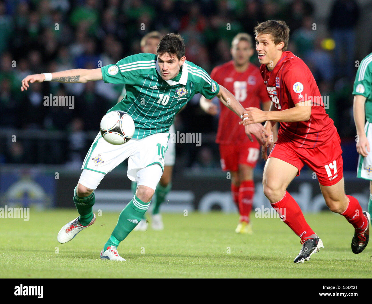 Northern Ireland's Dean Kyle Lafferty (left) in action with Luxembourg ...