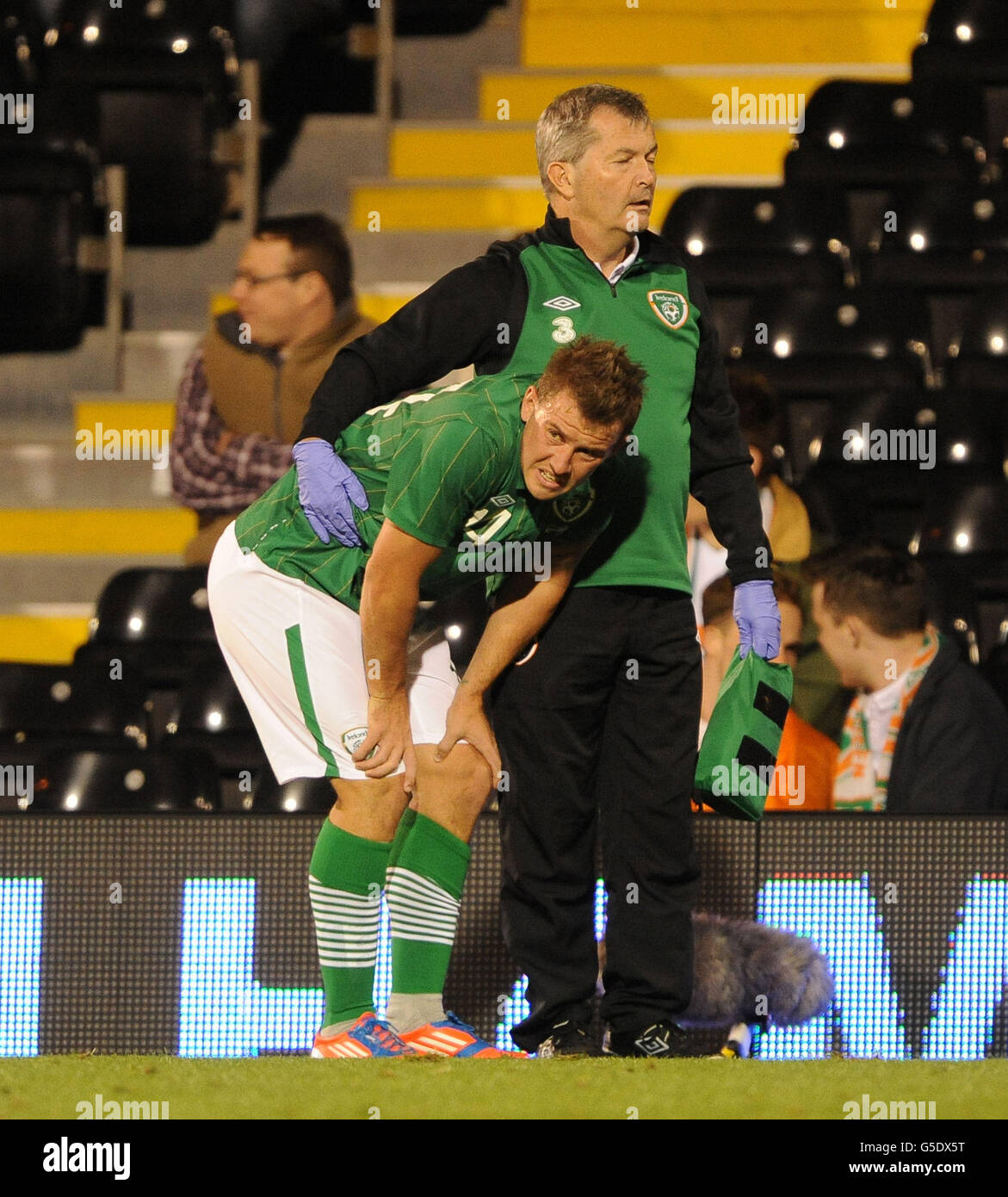 Republic of Ireland's Simon Cox goes off injured against Oman during ...