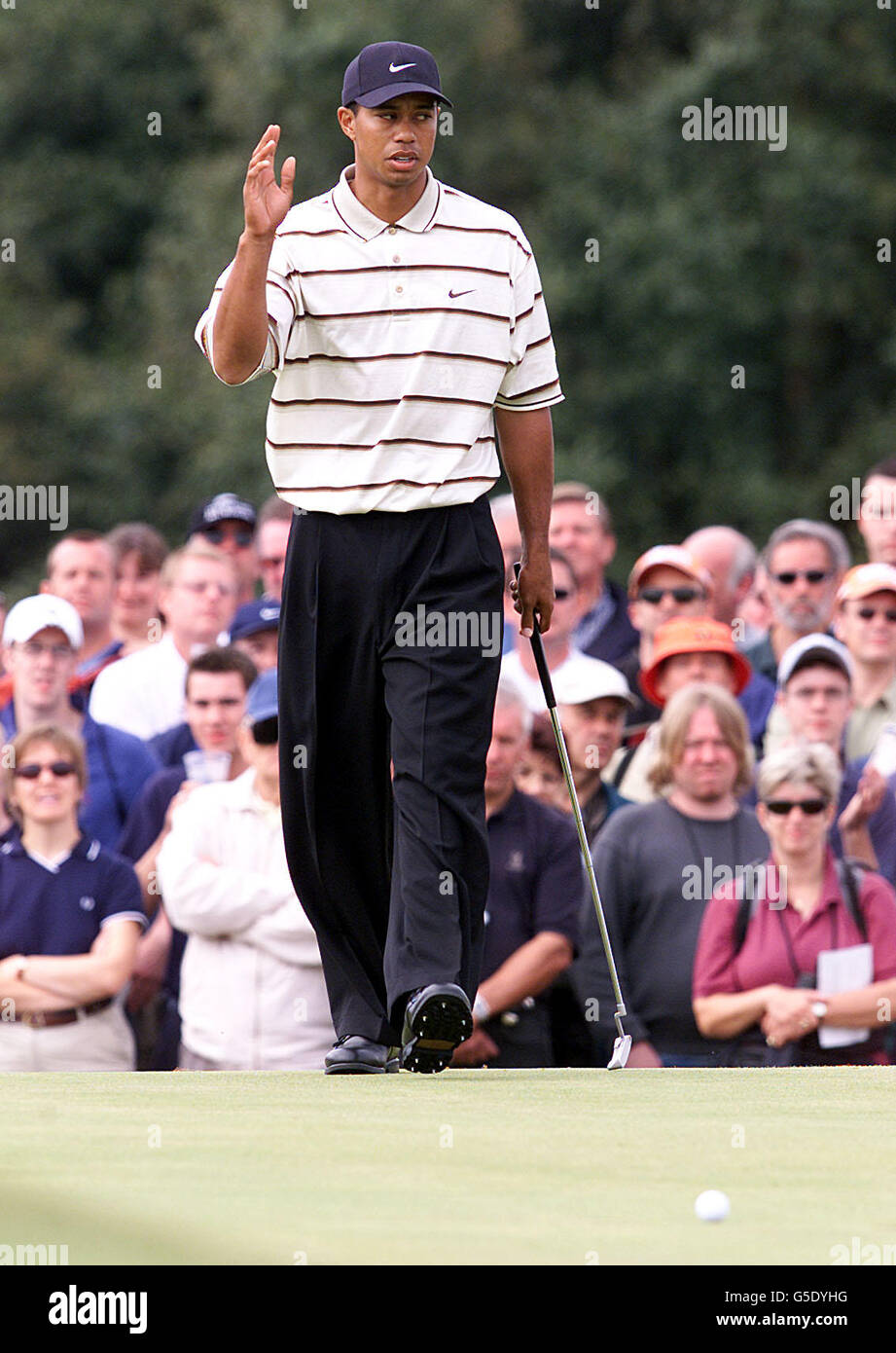 America's Tiger Woods waves to the crowd on the 7th green during the ...