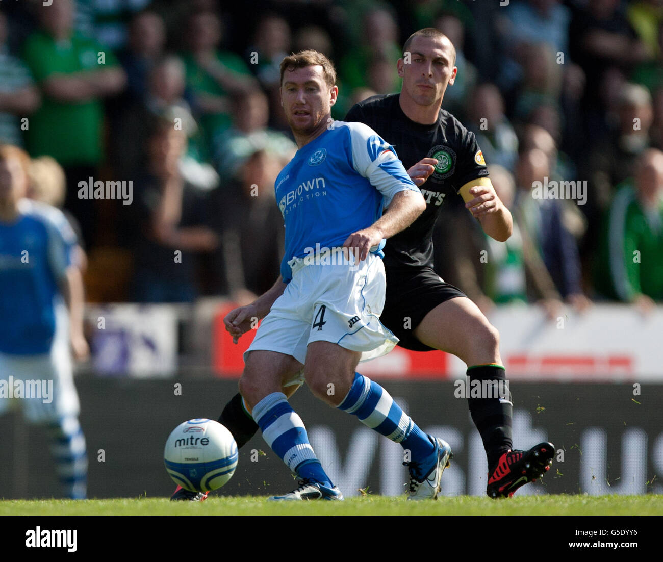 St Johnstone's Patrick Cregg shields the ball from Celtic's Scott Brown ...