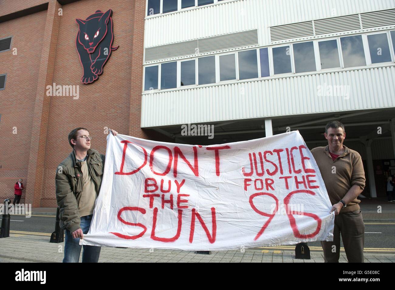 Liverpool fans display a banner in protest against the sun prior to the ...