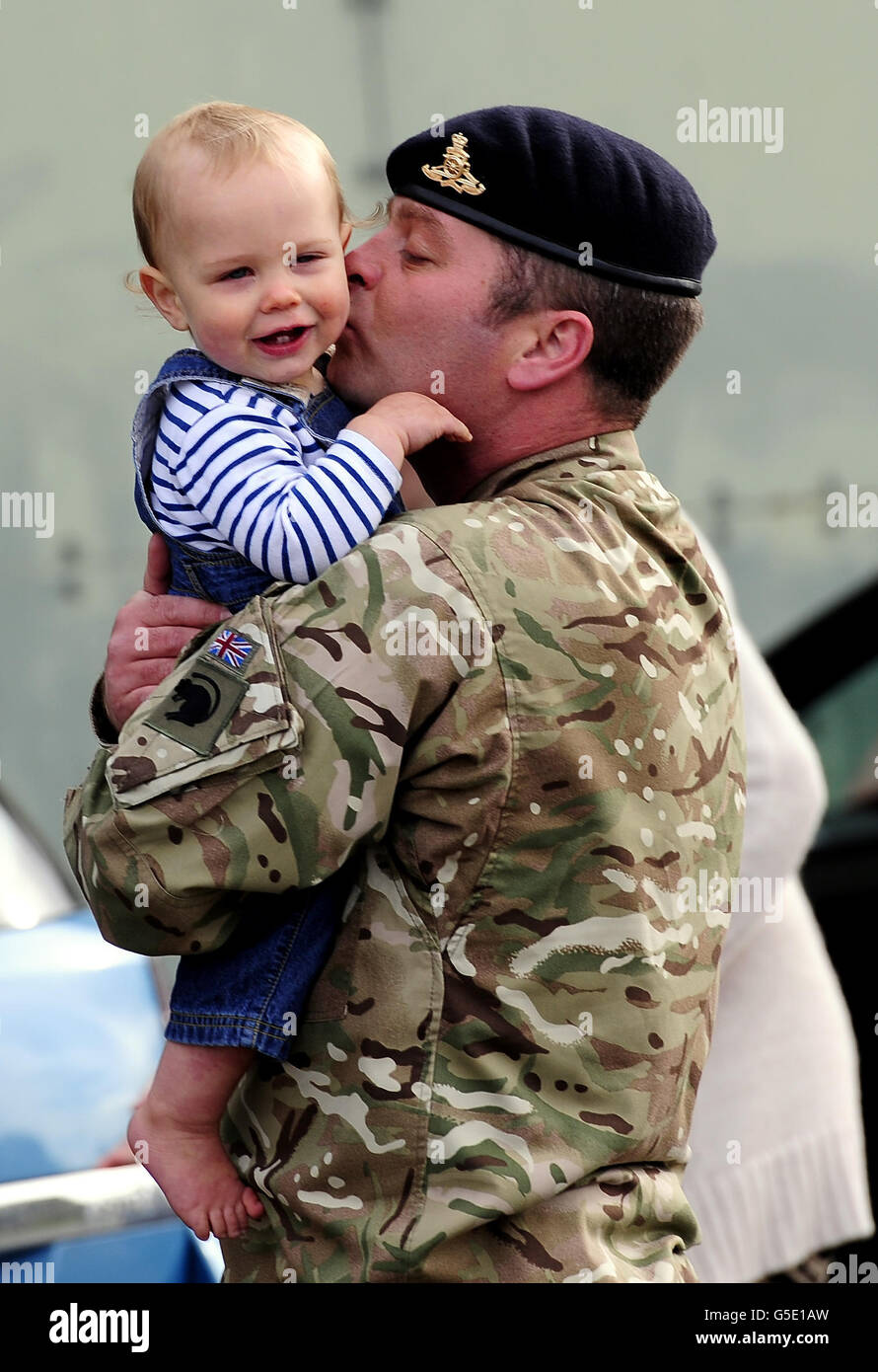 WO2 Simon Bell kisses goodbye to his baby son Matthew as he leaves with ...