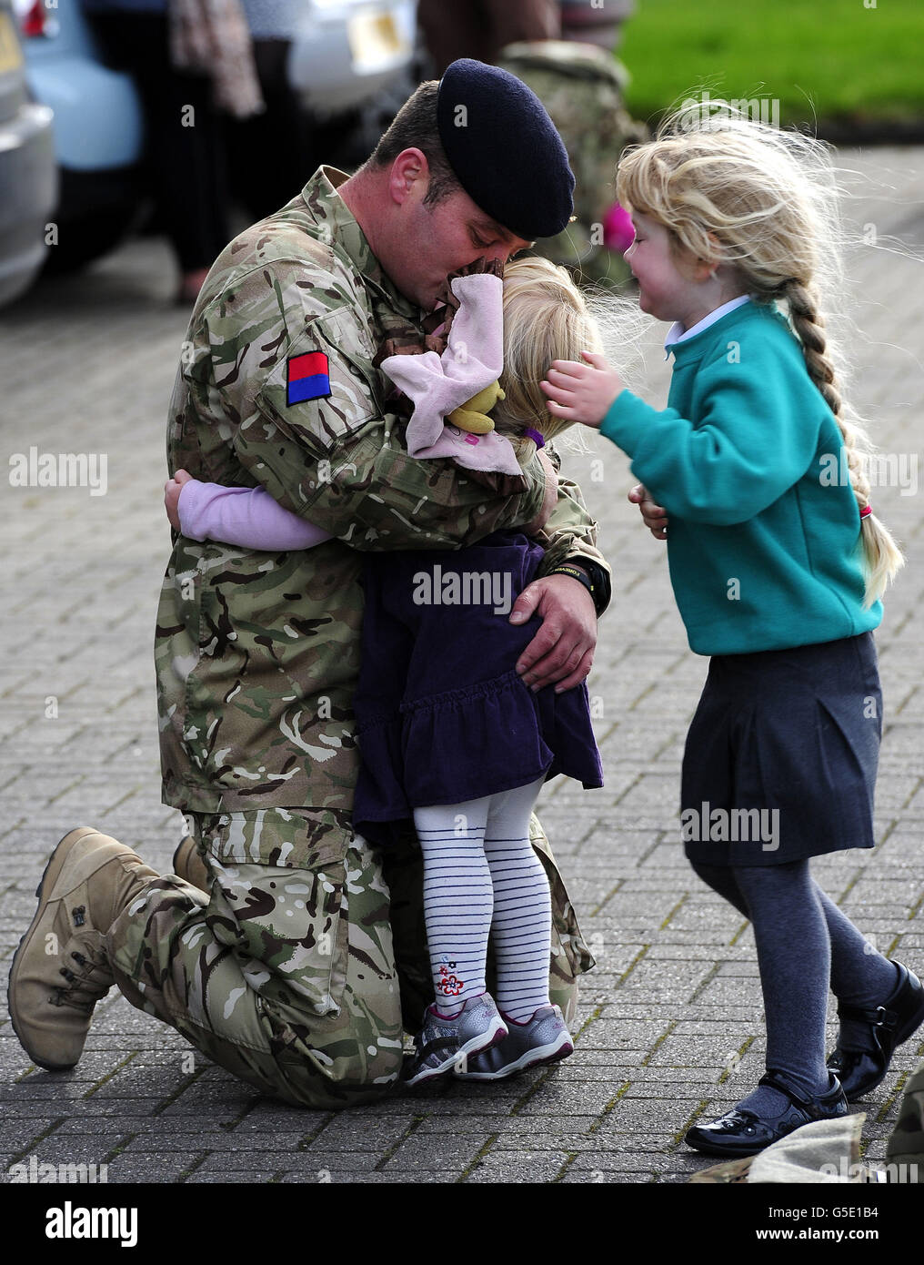 WO2 Simon Bell kisses goodbye to his daughters Alice and Catherine ...