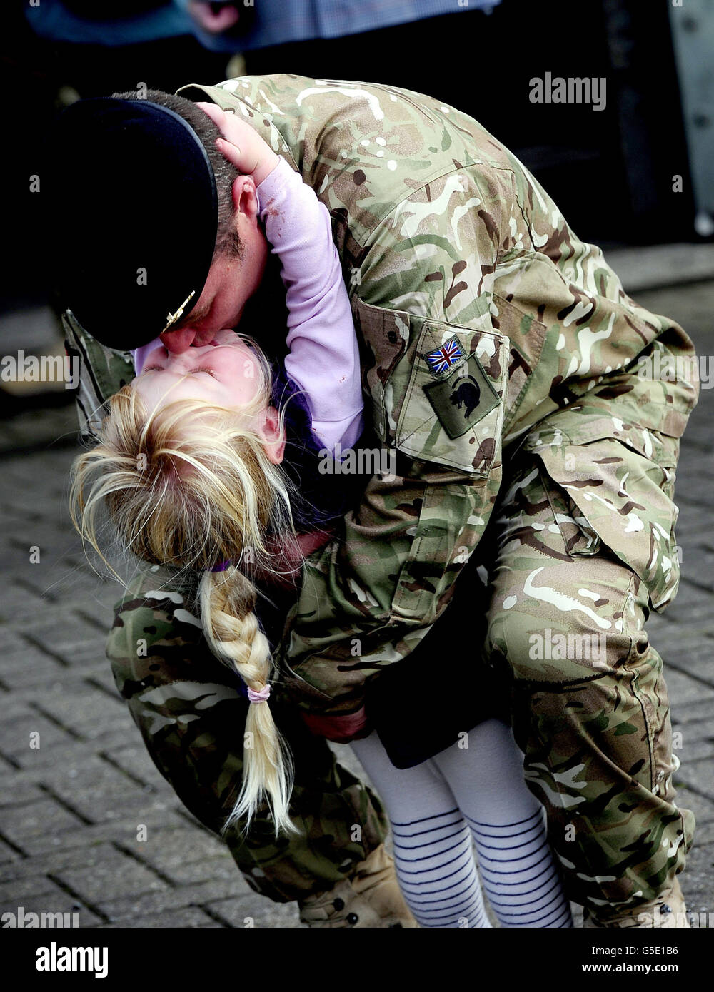 WO2 Simon Bell kisses goodbye to his daughter Alice as he leaves with 4 ...
