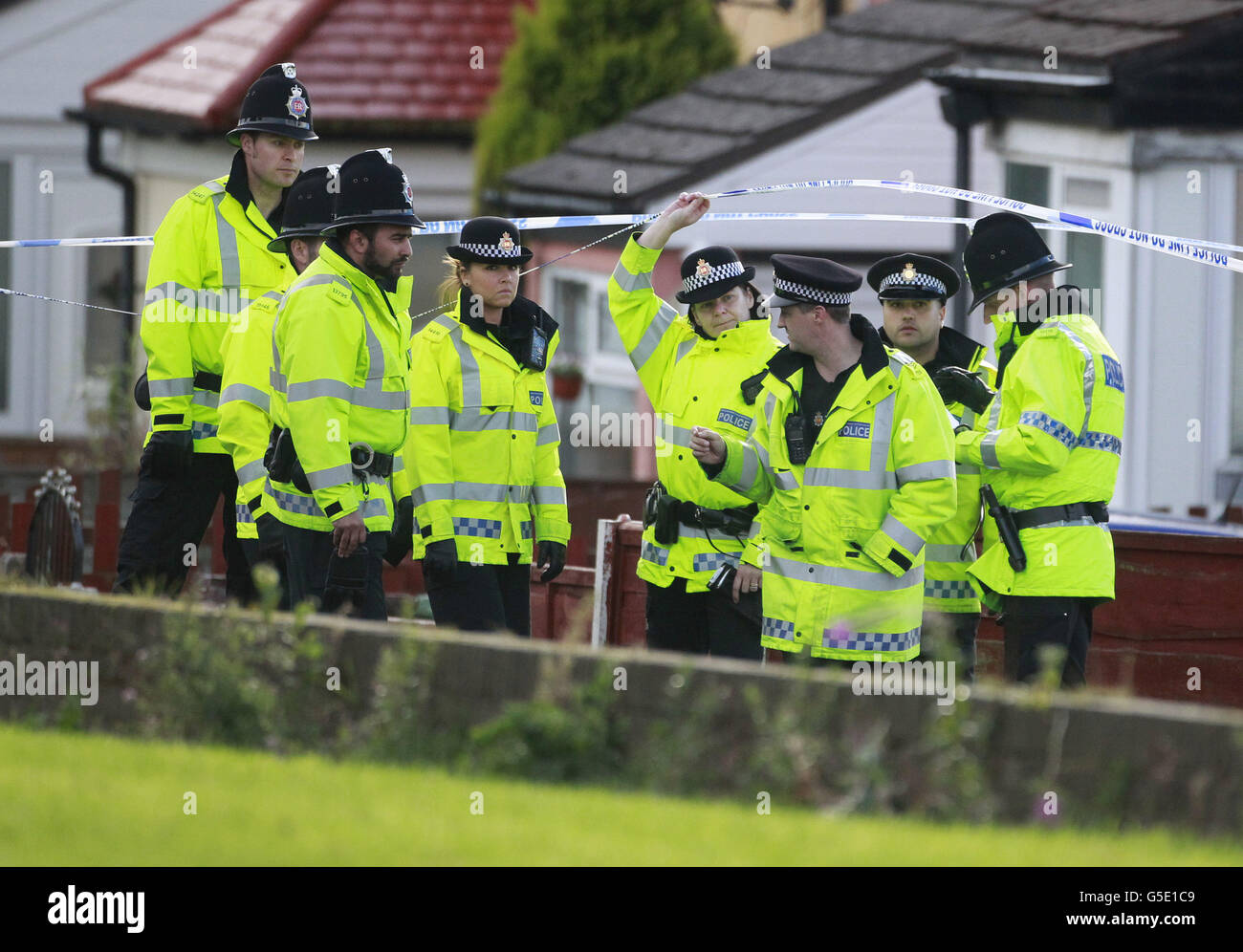 Greater Manchester police officers at the scene of a shooting in ...