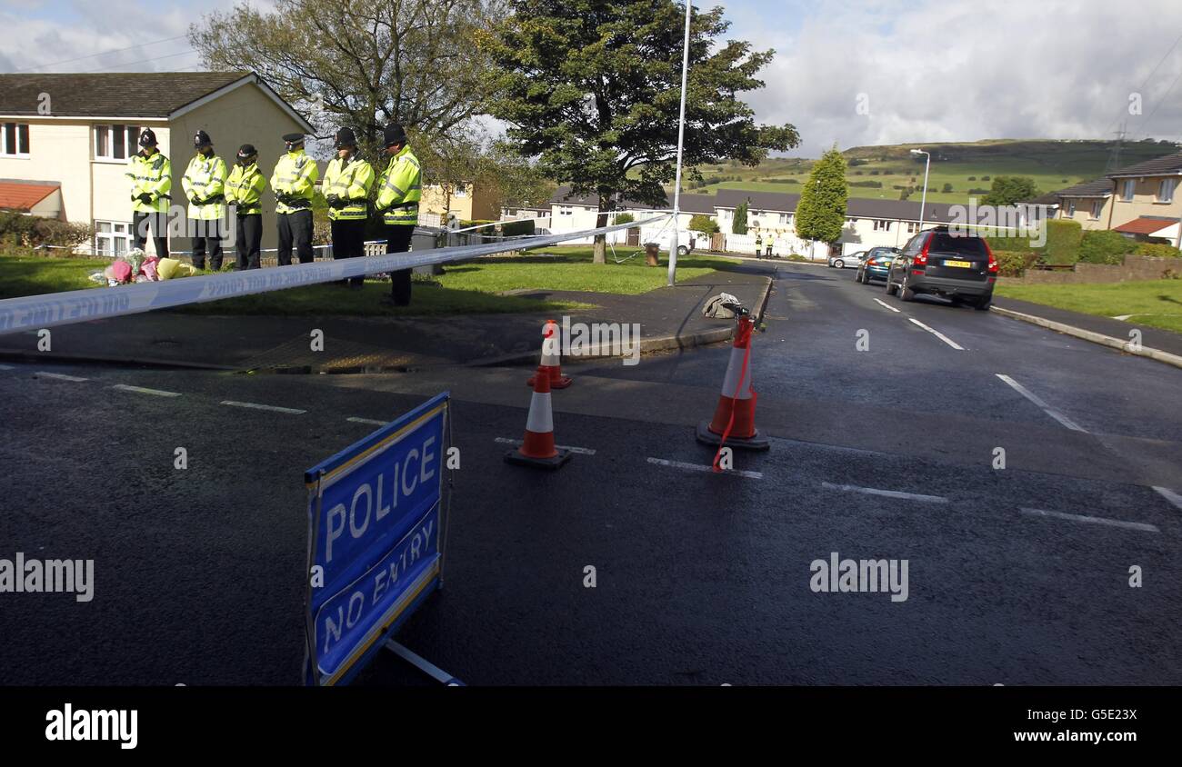 Greater Manchester Police officers observe a minute's silence near to ...
