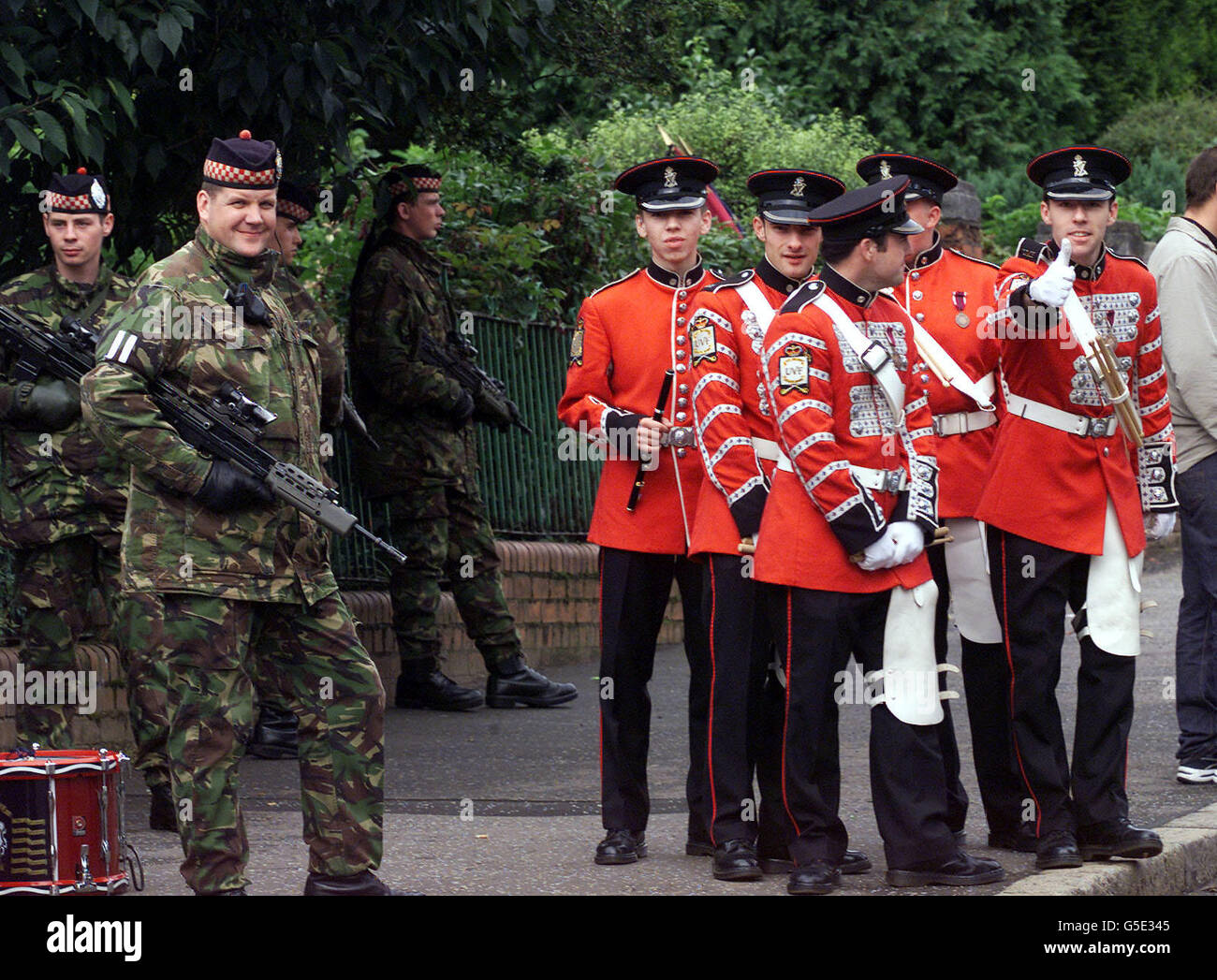 Loyalist marchers in a stand-off with British soldiers at a police road ...