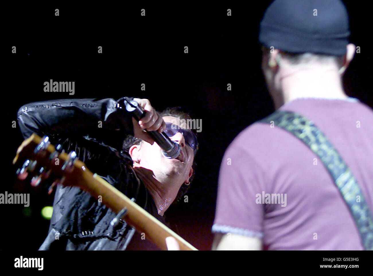 U2 lead singer Bono (left) with Edge live on stage at the Manchester ...