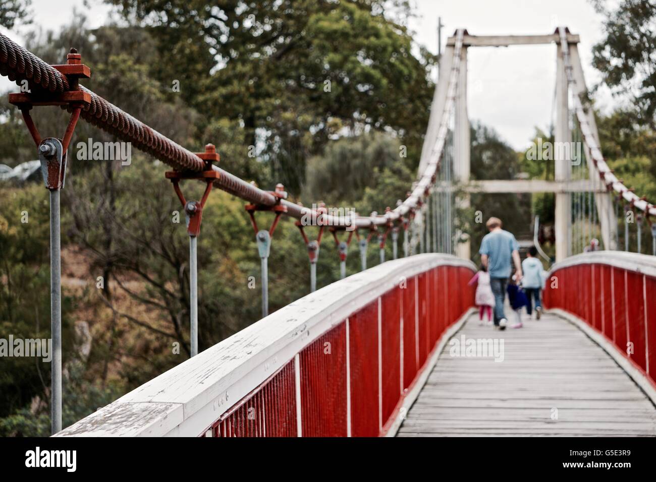 Walking across a hanging bridge Stock Photo - Alamy