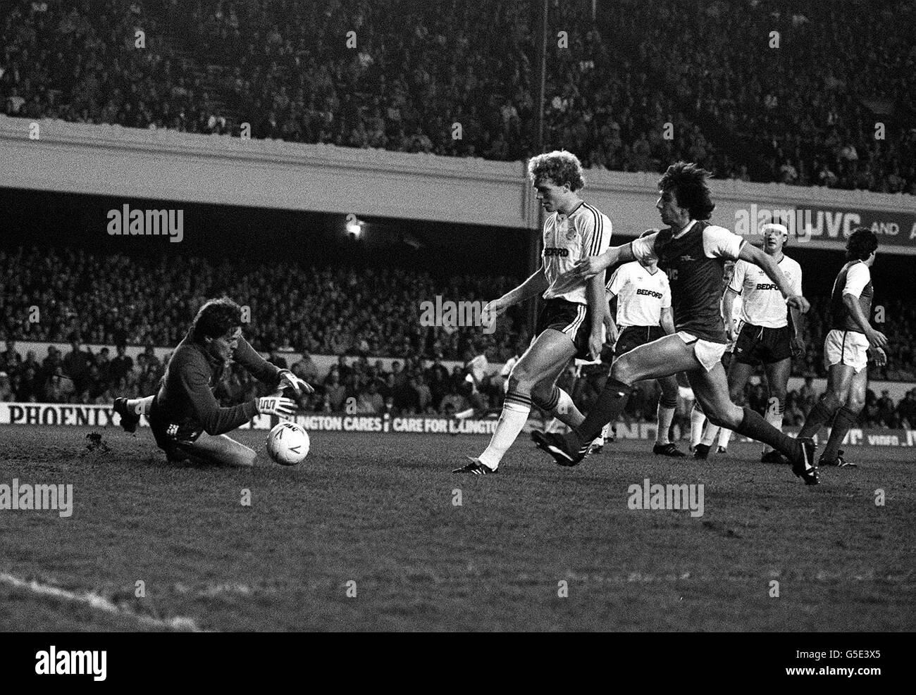 Luton Town's goalkeeper Les Sealey saves the ball from Arsenal's Paul ...