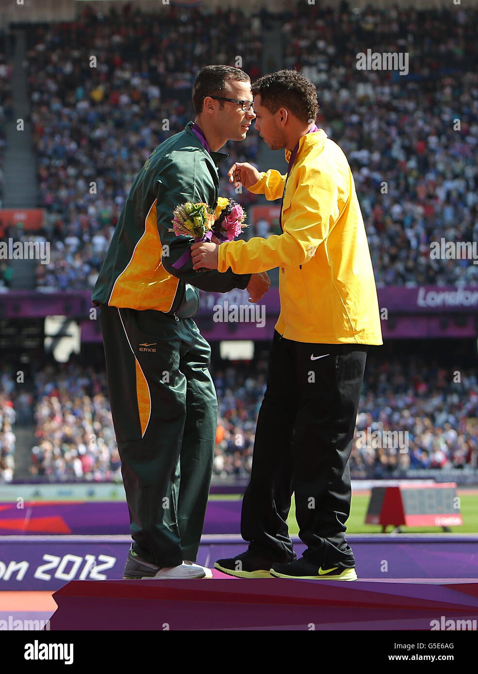 Silver medalist South Africa's Oscar Pistorius (left) shakes hands with ...