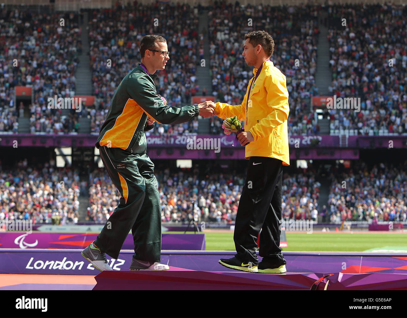 Silver medalist South Africa's Oscar Pistorius (left) shakes hands with ...