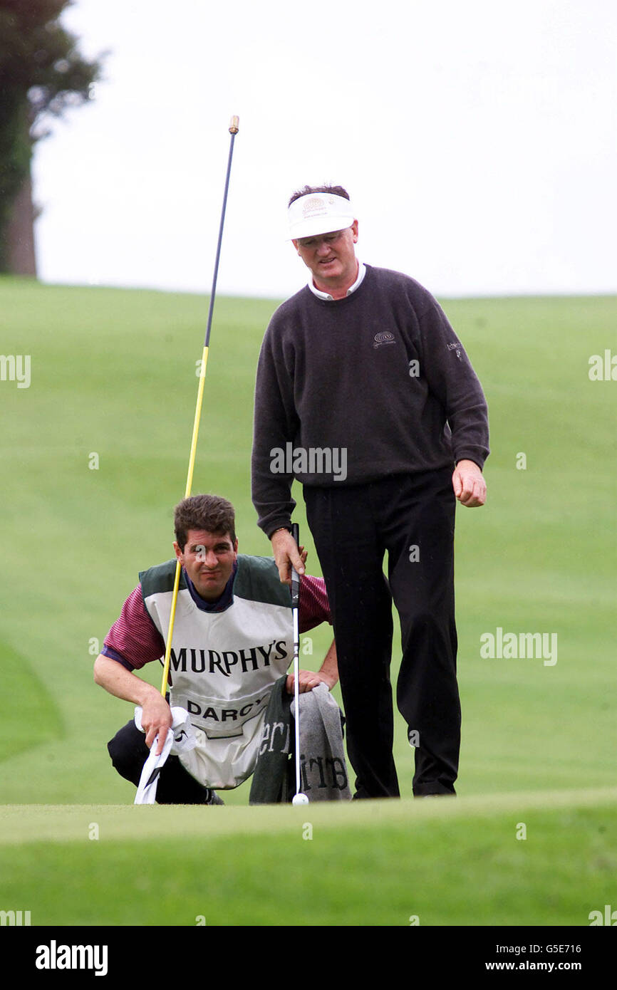 Ireland's Eamonn Darcy lines up his putt on the last green during the ...