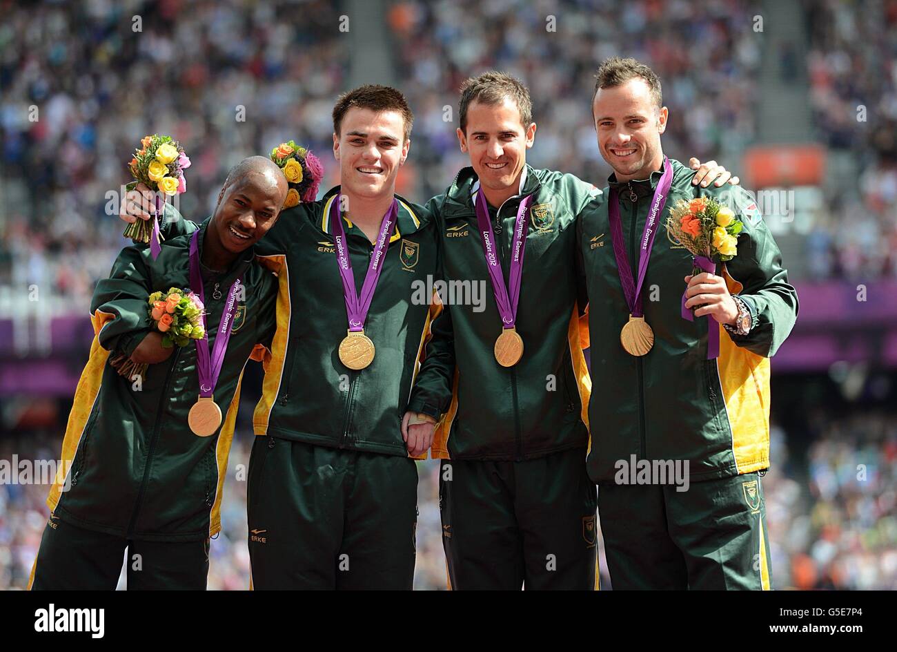 South africas oscar pistorius right team mates l r samkelo radebe hi ...