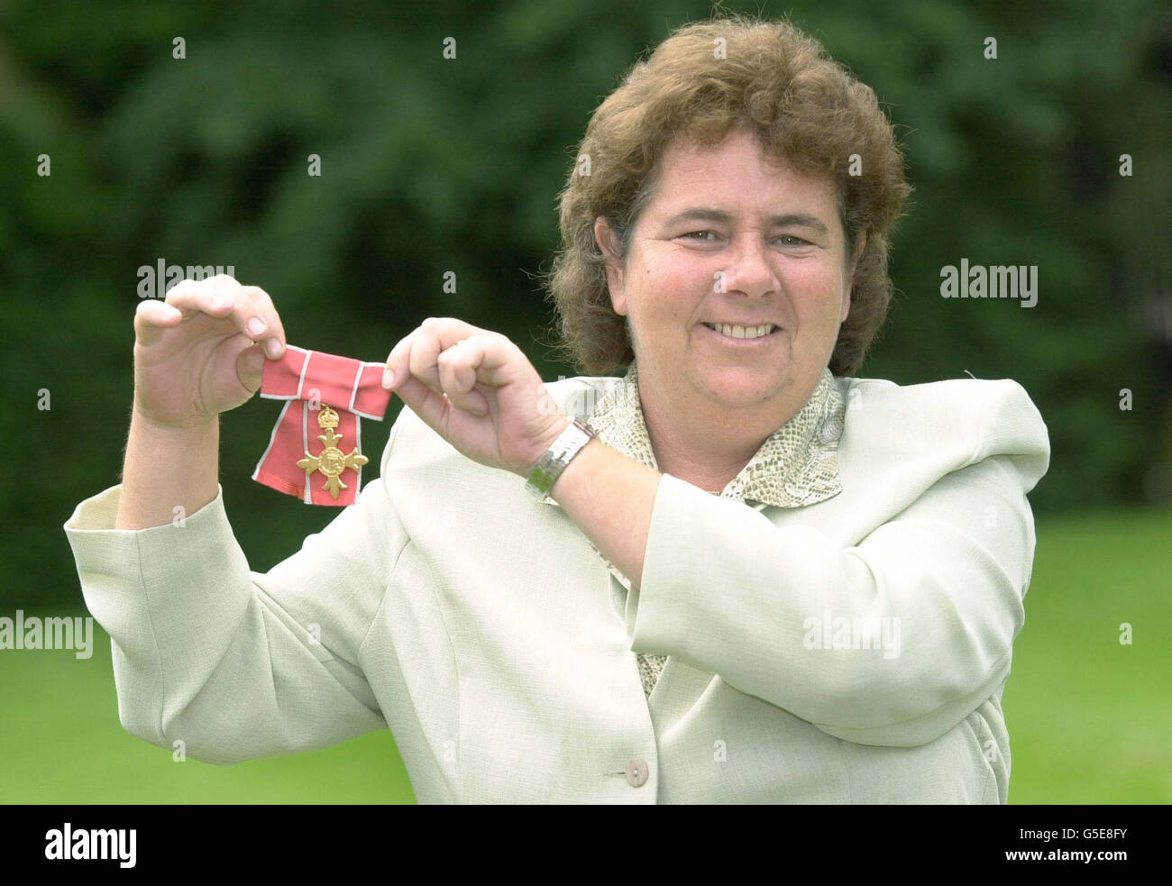 Miss Dale Reid displays the Officer of the Most Excellent Order of the ...