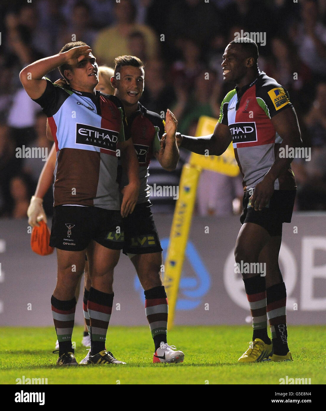 Harlequins' Ben Botica salutes the armed forces in the stands after ...