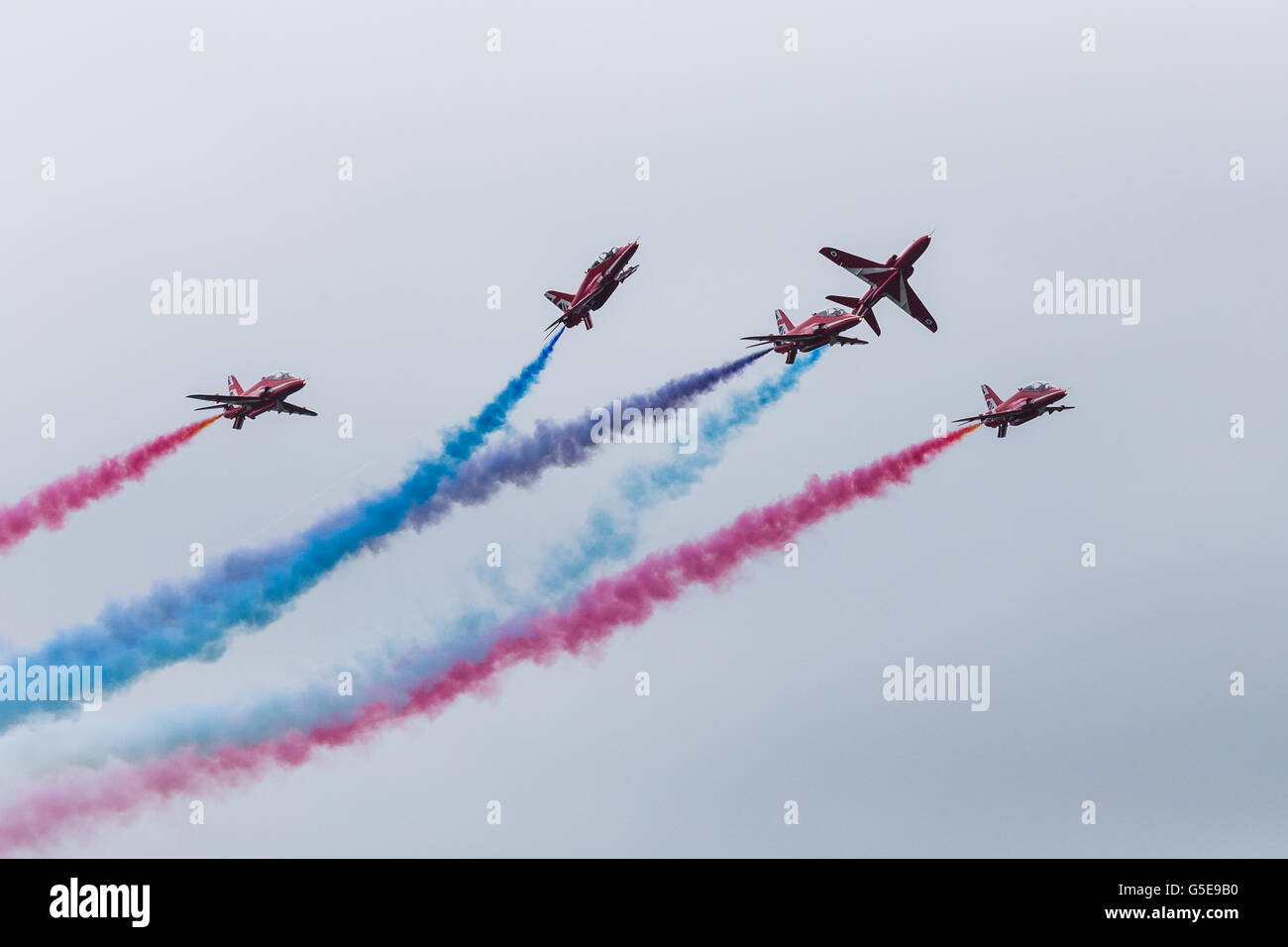 Rare shot of a Red Arrow trailing purple smoke Stock Photo - Alamy