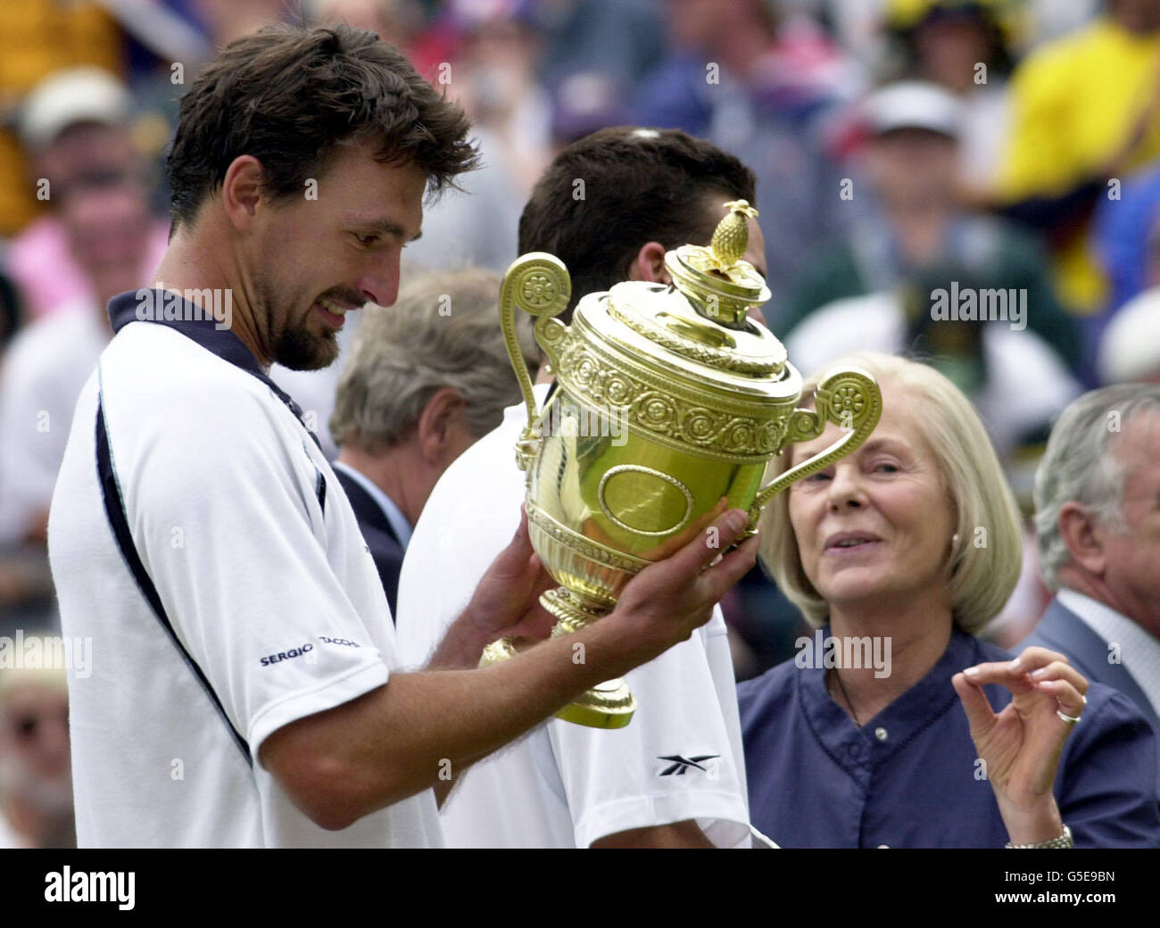 Goran Ivanisevic of Croatia celebrates with the trophy after beating ...