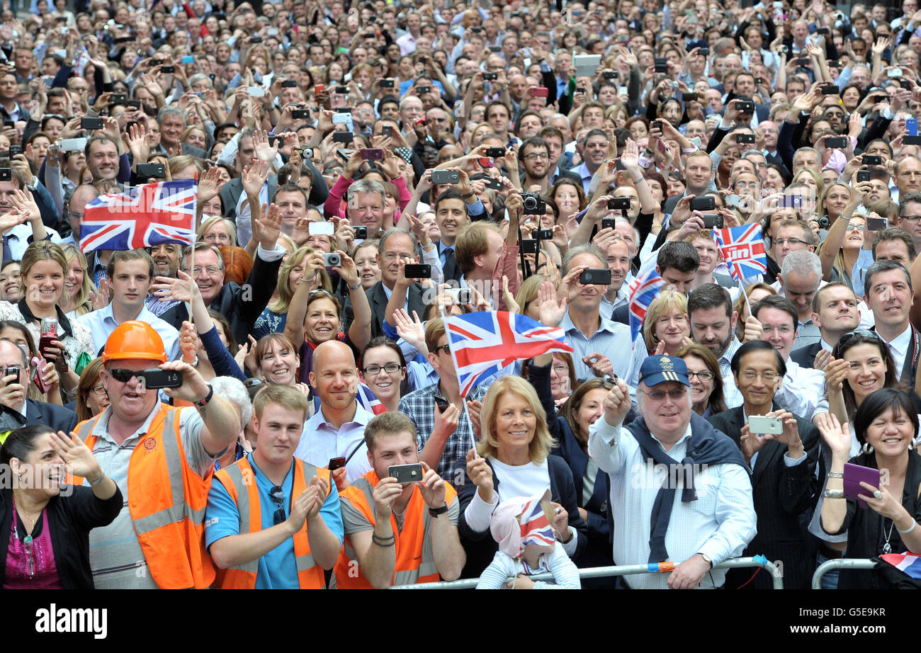 The crowd wave as the parade makes its way through London, celebrating ...