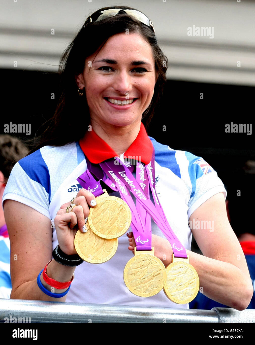 Great Britain's Sarah Storey shows her medals to the crowd as the ...