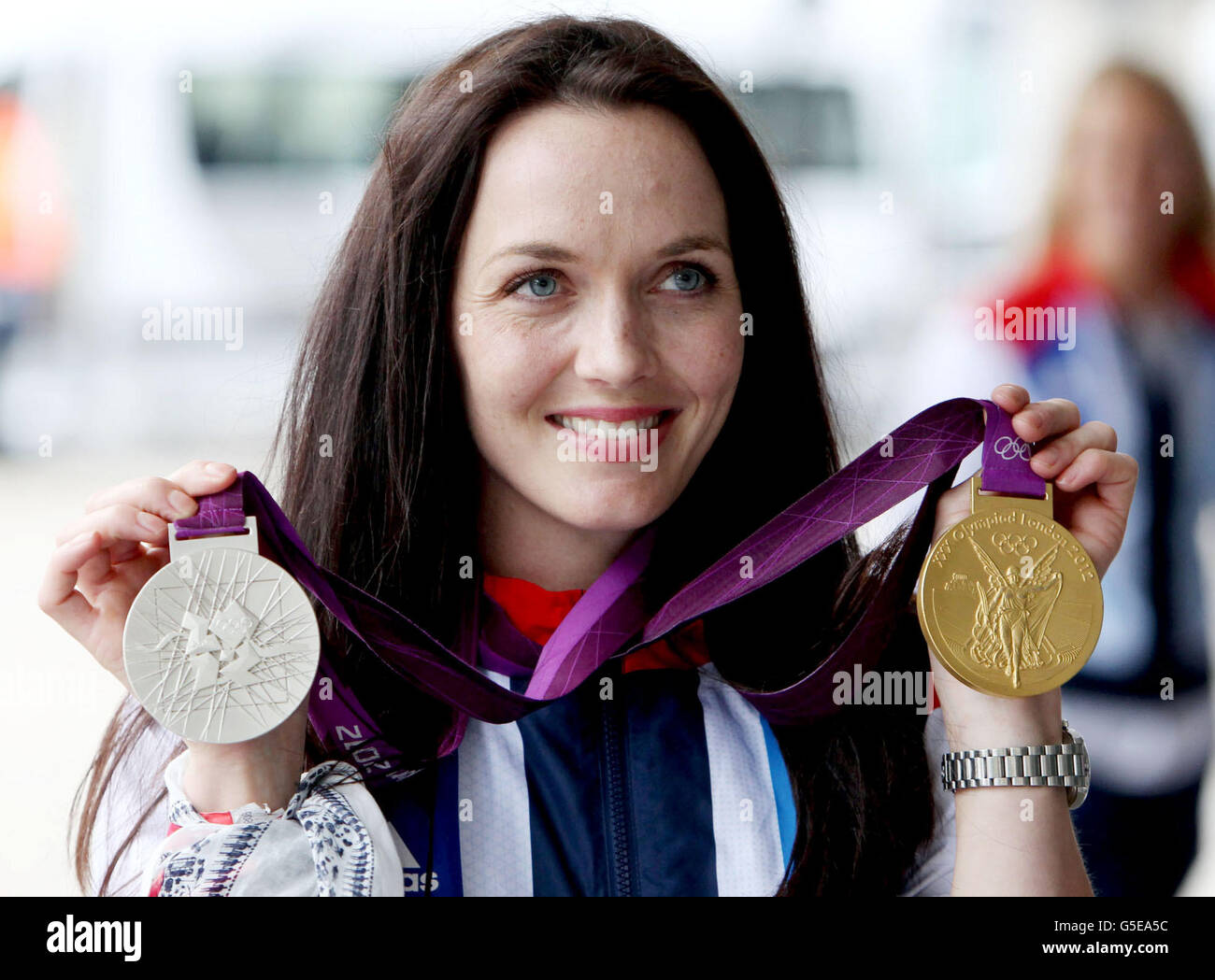 Victoria Pendleton shows her gold and silver medals during the Olympic ...
