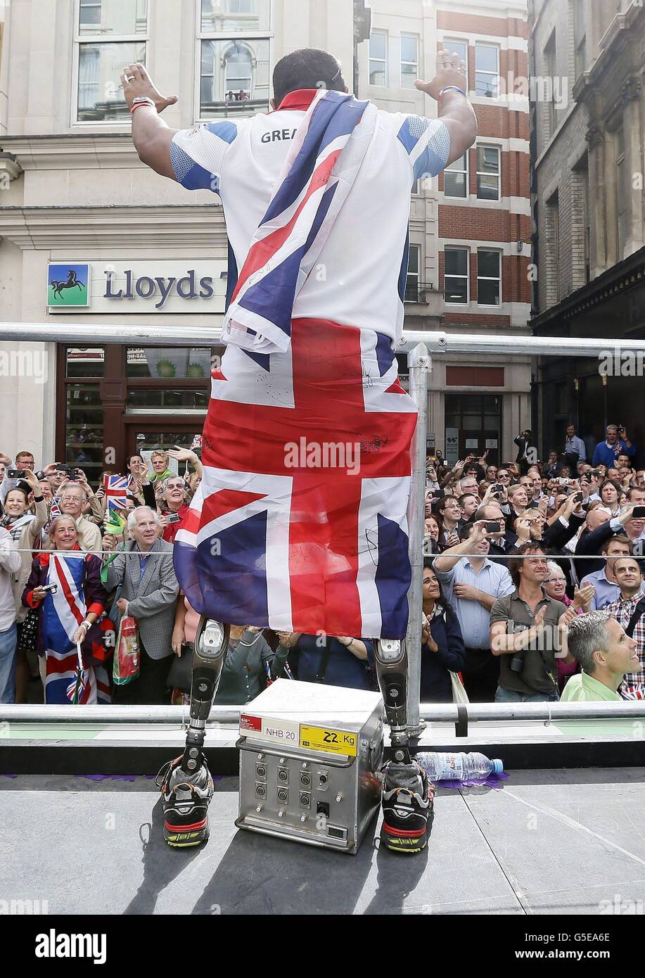 Paralympic discus thrower Derek Derenalagi waves to the crowd during a ...