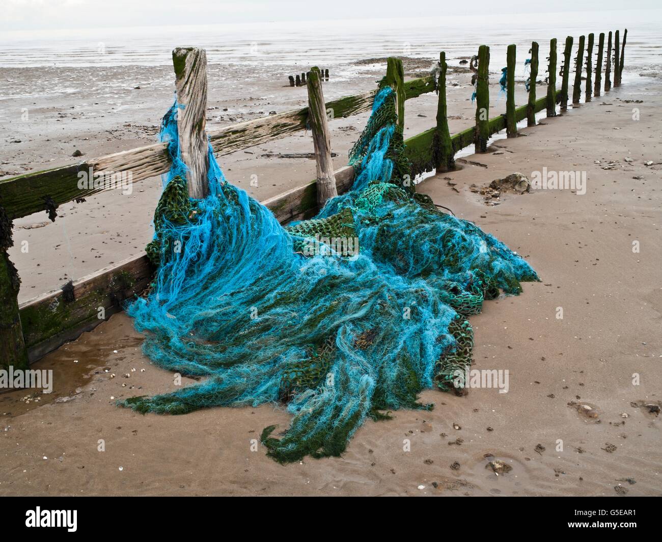 Abandoned fishing nets washed up on a beach Stock Photo - Alamy