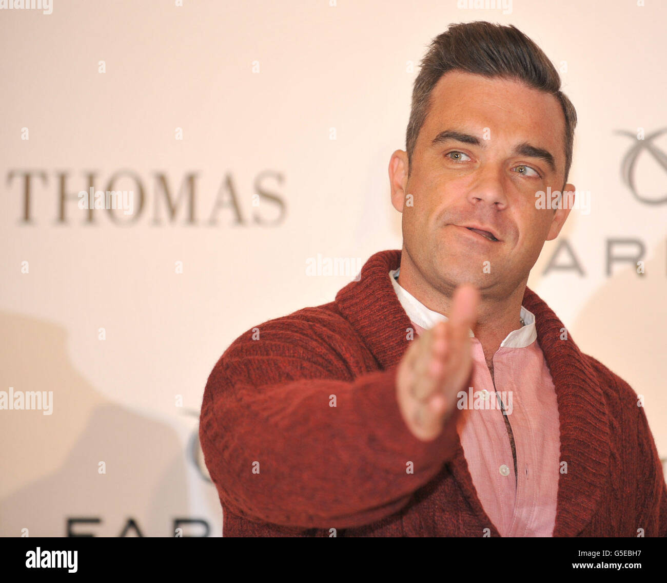 Singer robbie williams launch farrell hi-res stock photography and ...