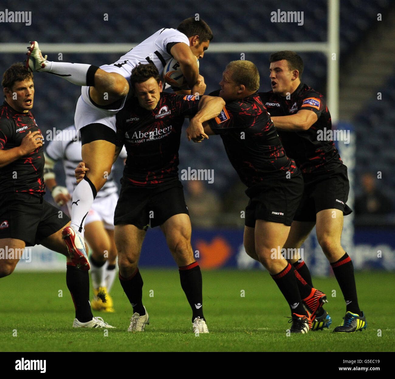 Zebre's Giovanbattista Venditti in action with Edinburgh's Nick de Luca ...