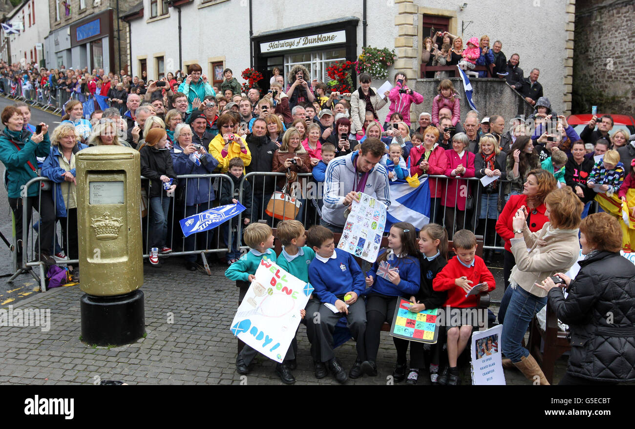 Andy Murray is given a well done card during a walkabout in Dunblane ...