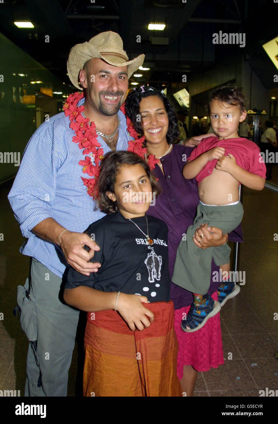 Relief cowboy hat smiling blue shirt happy carrying child hi-res stock ...