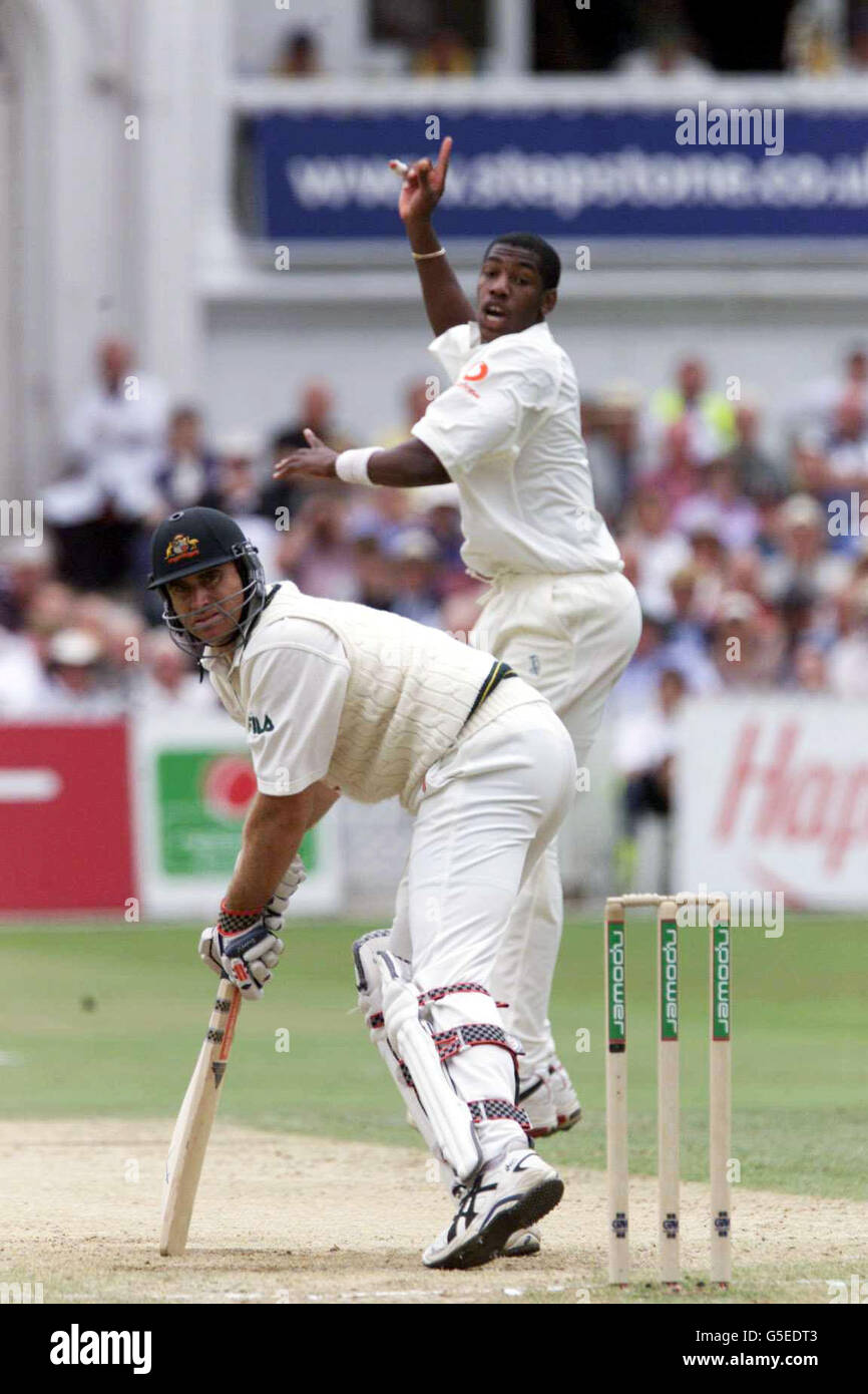 England's Alex Tudor celebrates taking the wicket of Australia's ...