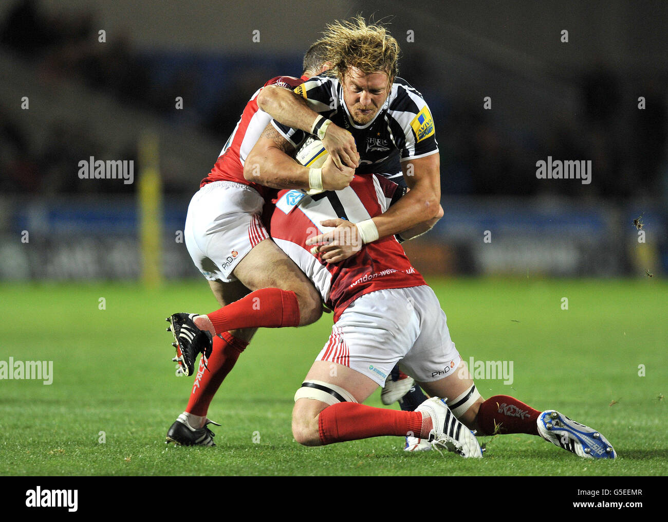 Sale Sharks Andy Powell is tackled by London Welsh's Gordon Ross (left ...