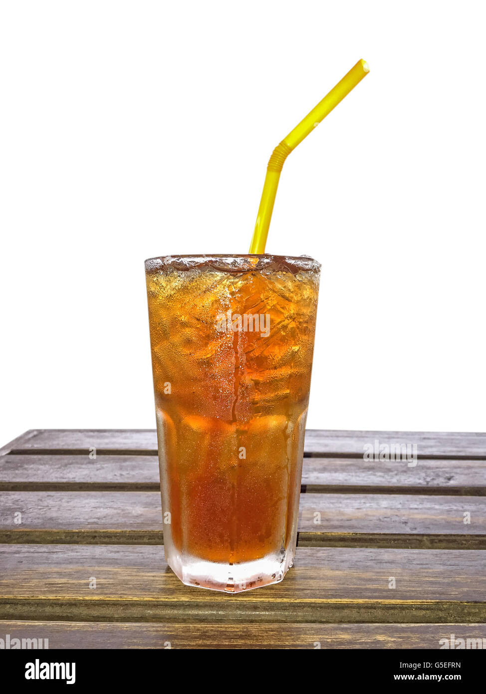 Cold glass of iced tea with ice cubes isolated on white background ...