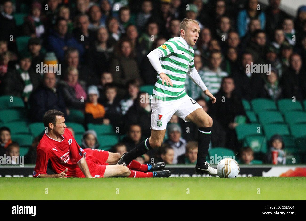 Celtic's Dylan McGeough and Raith Rover's Grant Anderson battle for the ...