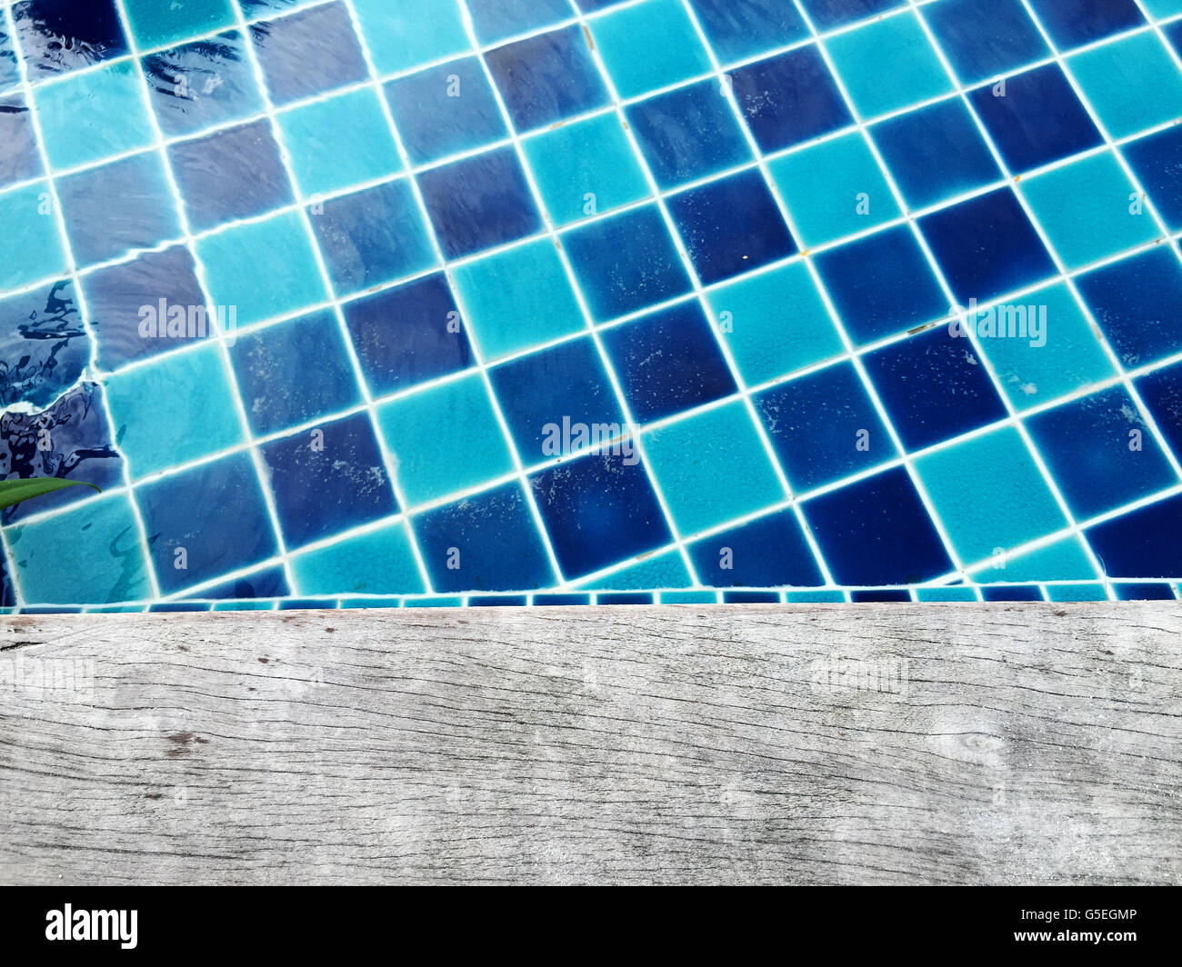 Wooden pier floor beside the blue swimming pool view from above Stock ...