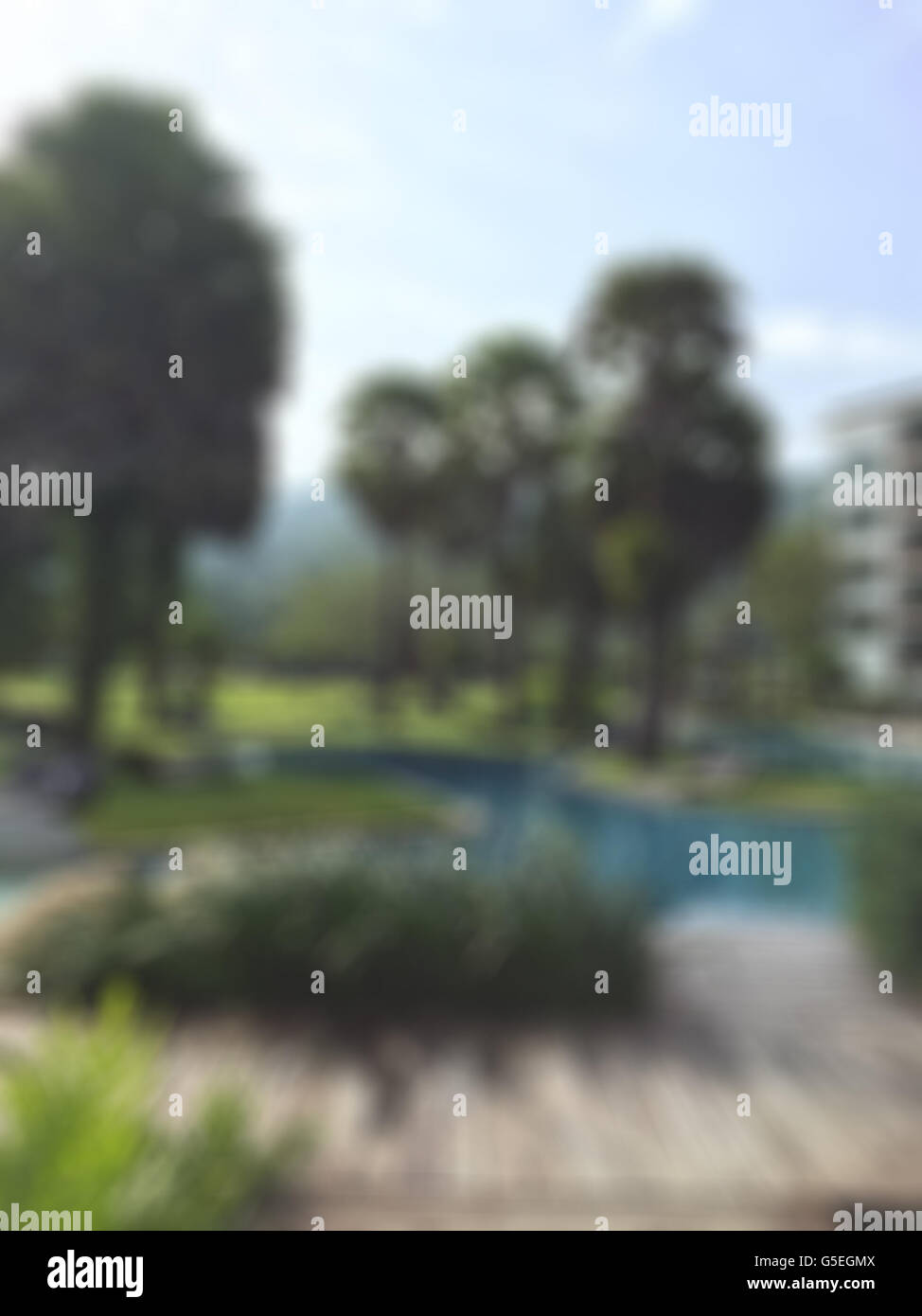 Blurry image view of swimming pool used as background Stock Photo - Alamy