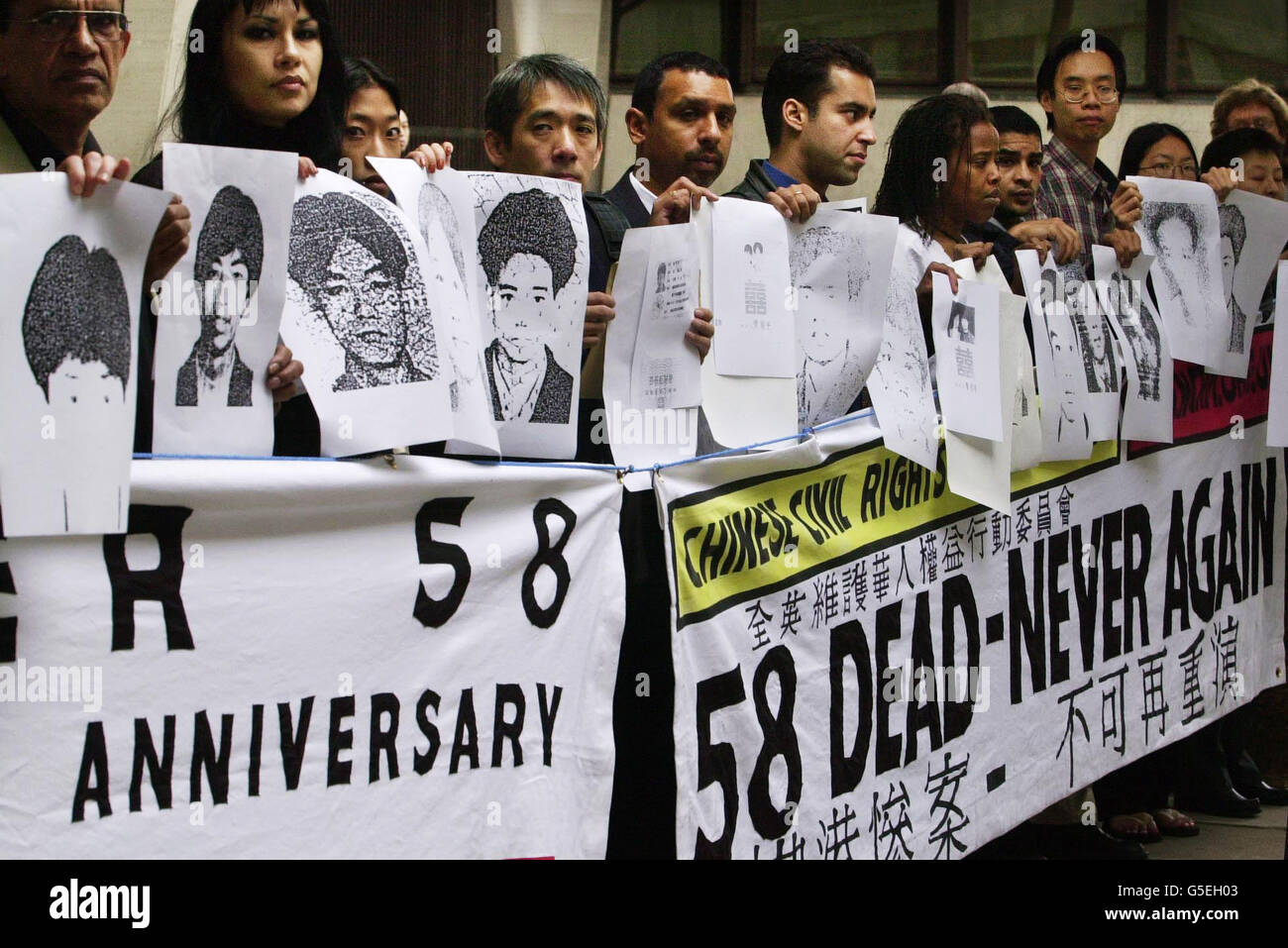 Members of the Chinese Civil Rights Action Group, holding images of the ...
