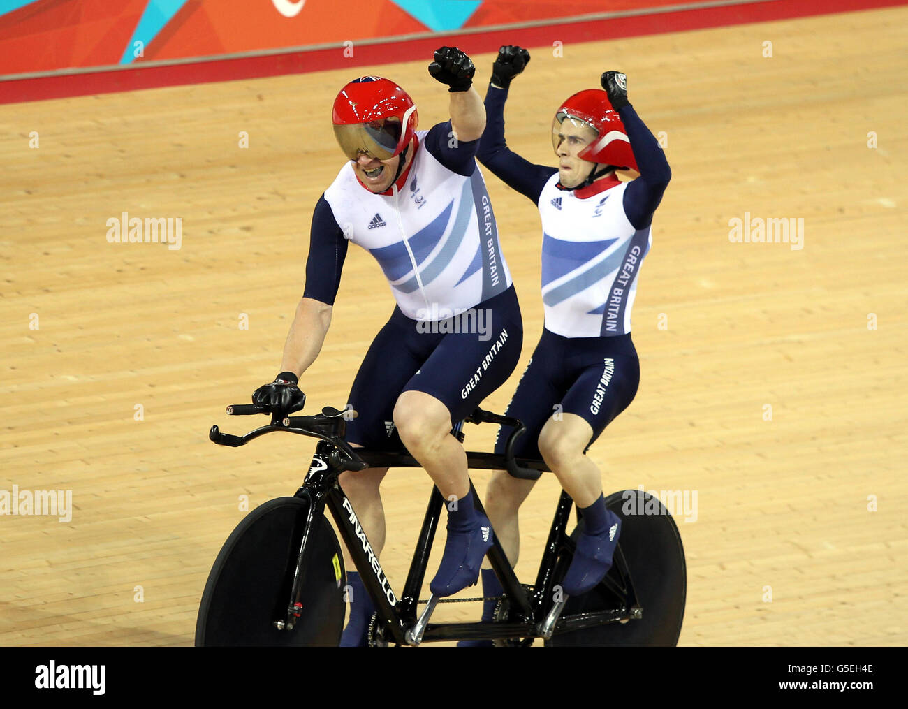 Great Britain's Neil Fachie and Barney Storey celebrate winning gold in ...