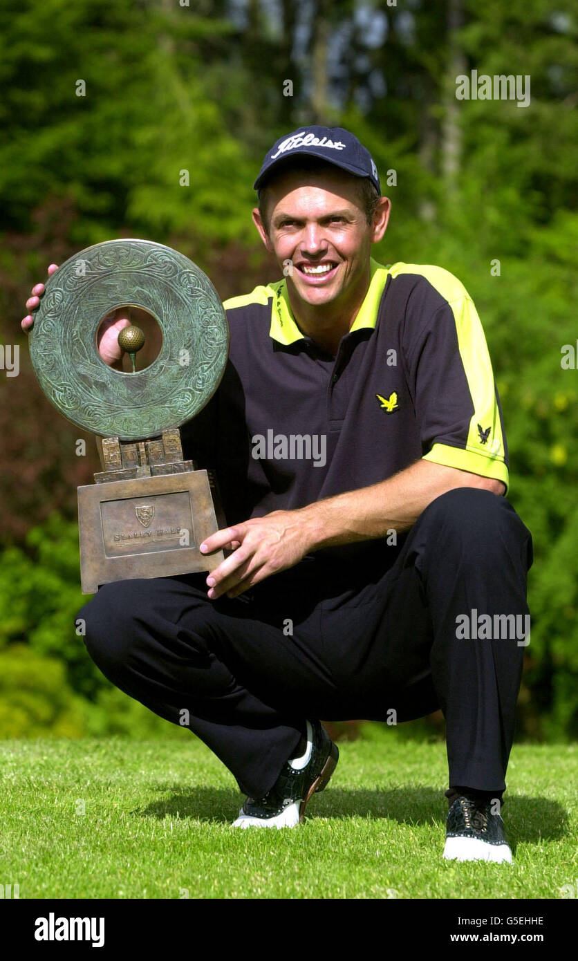 Scotland's Andrew Coltart holds the trophy after winning the Great ...