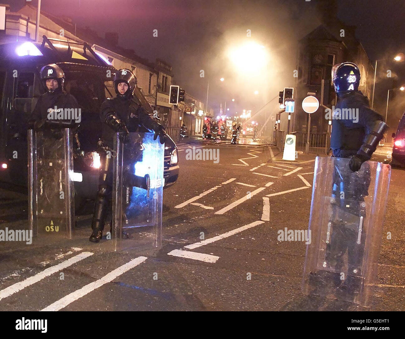 Police officers in full riot gear man a blockade on Colne road in ...
