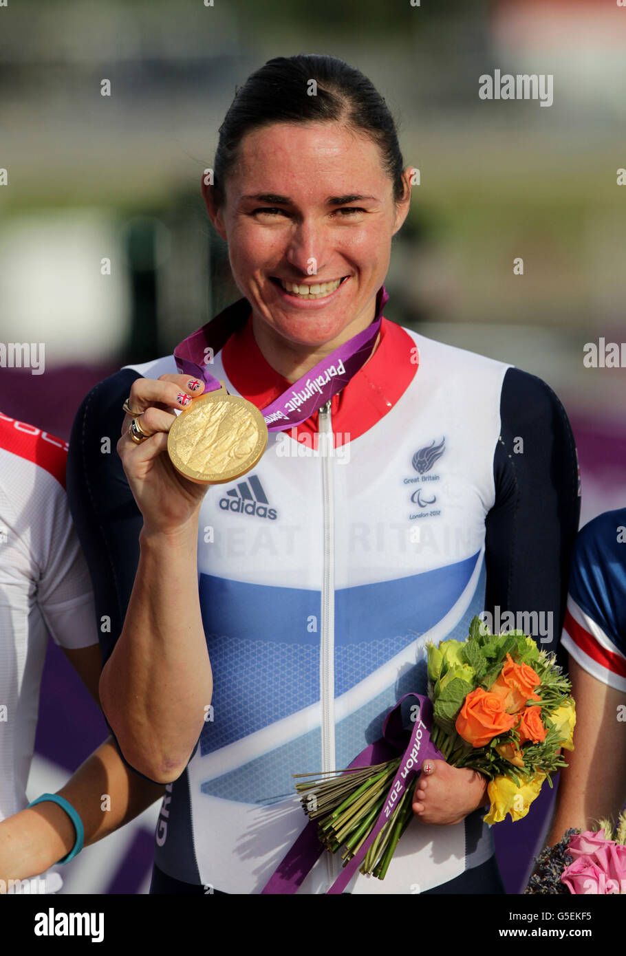 Great Britain's Sarah Storey celebrates on the podium with her gold ...