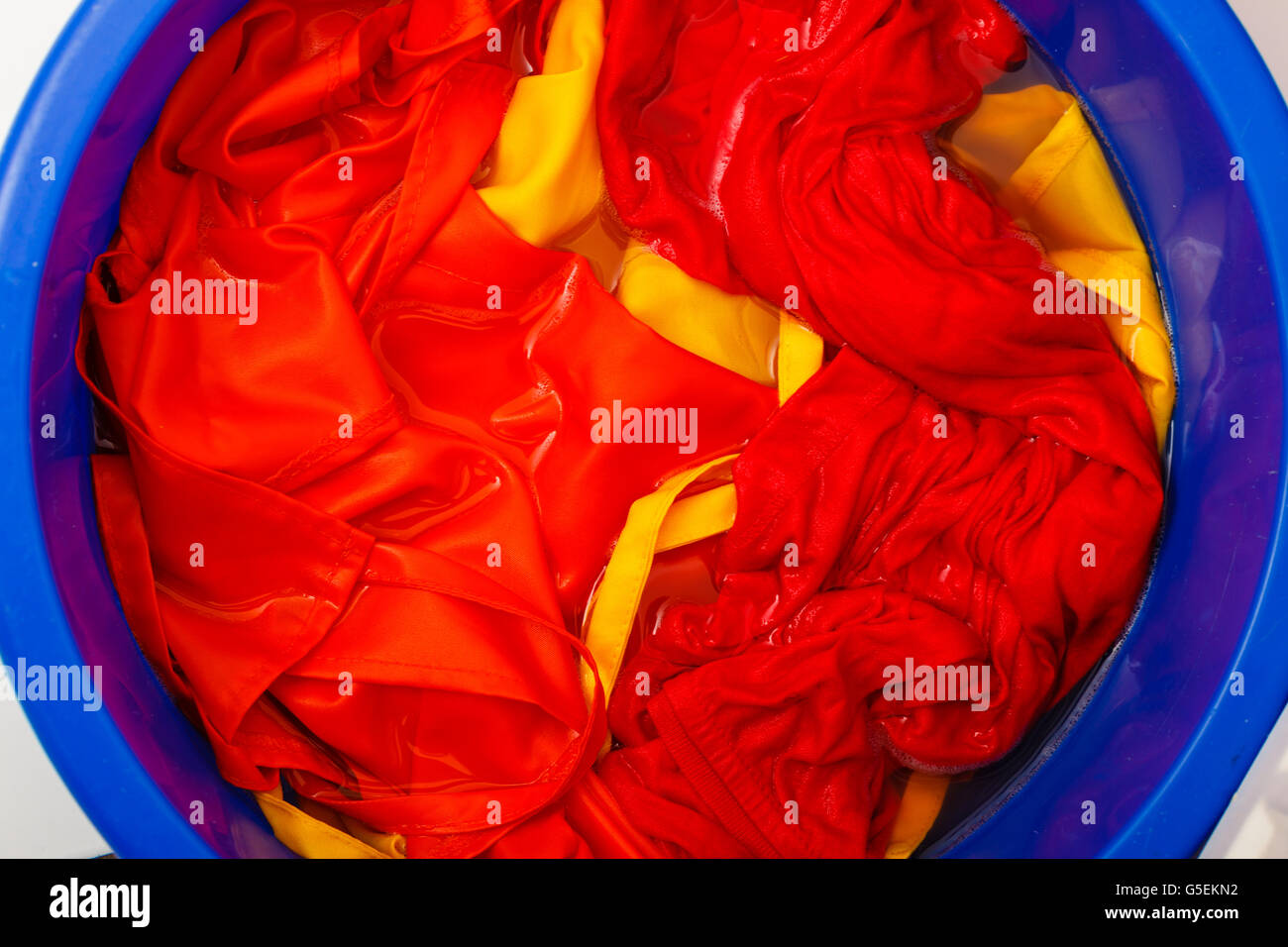 Housework chores domestic clean ygene concept. Wet clothes in plastic ...