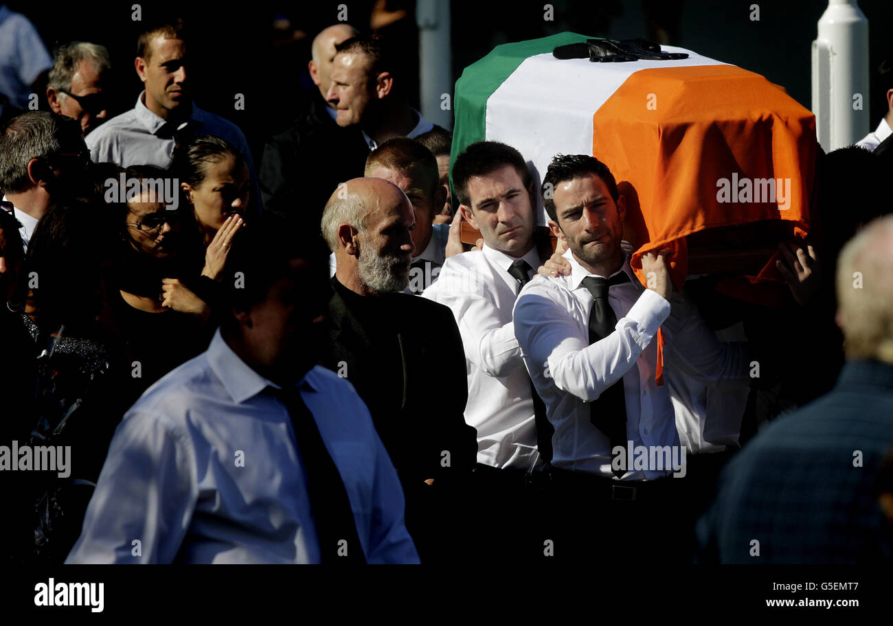 Mourners attend the funeral of Real IRA member Alan Ryan at the Church ...