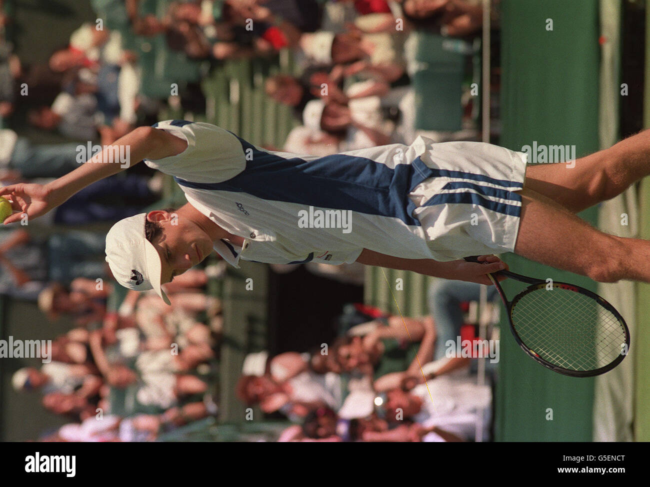 Britain's Tim Henman waves to the crowd after his first round victory ...