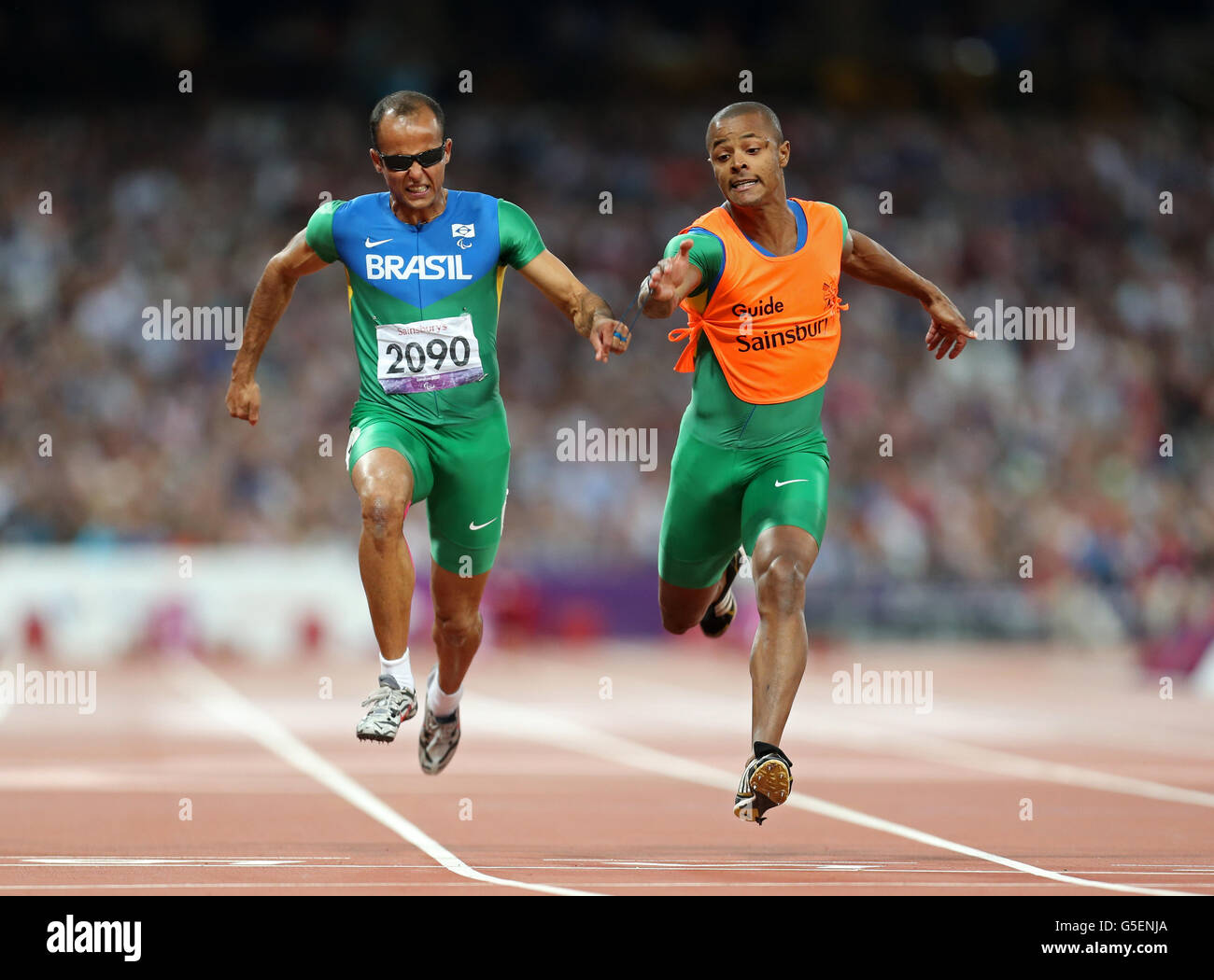 Brazil's Lucas Prado with Guide Justino Barbosa dos Santos run to ...