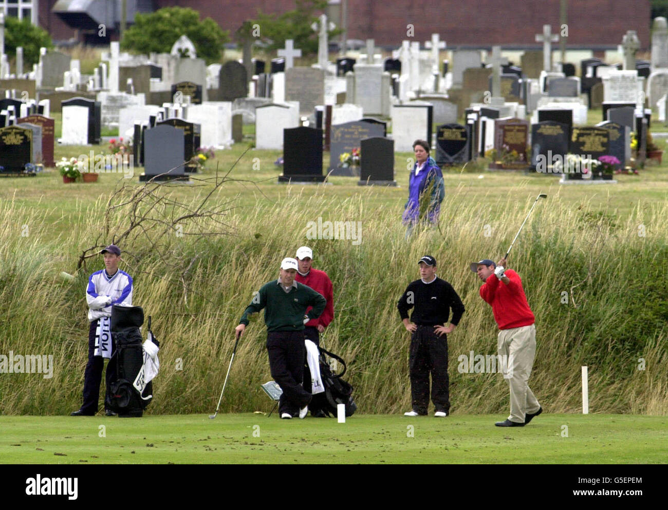 Paraguay's Marco Ruiz tees off the 8th tee, watched by Amateur Farran ...