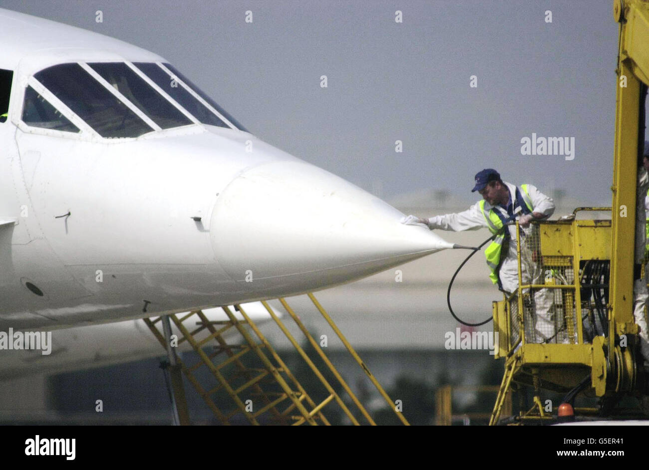 A ground engineer cleans the front of Concorde at the British Airways ...