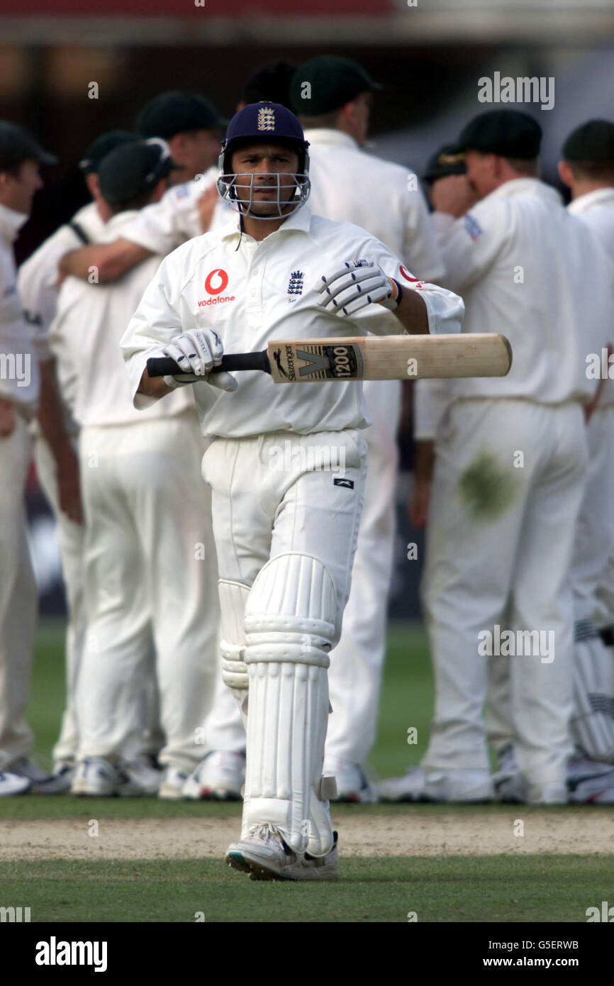 England's Mark Ramprakash walks back to the pavillion after being ...